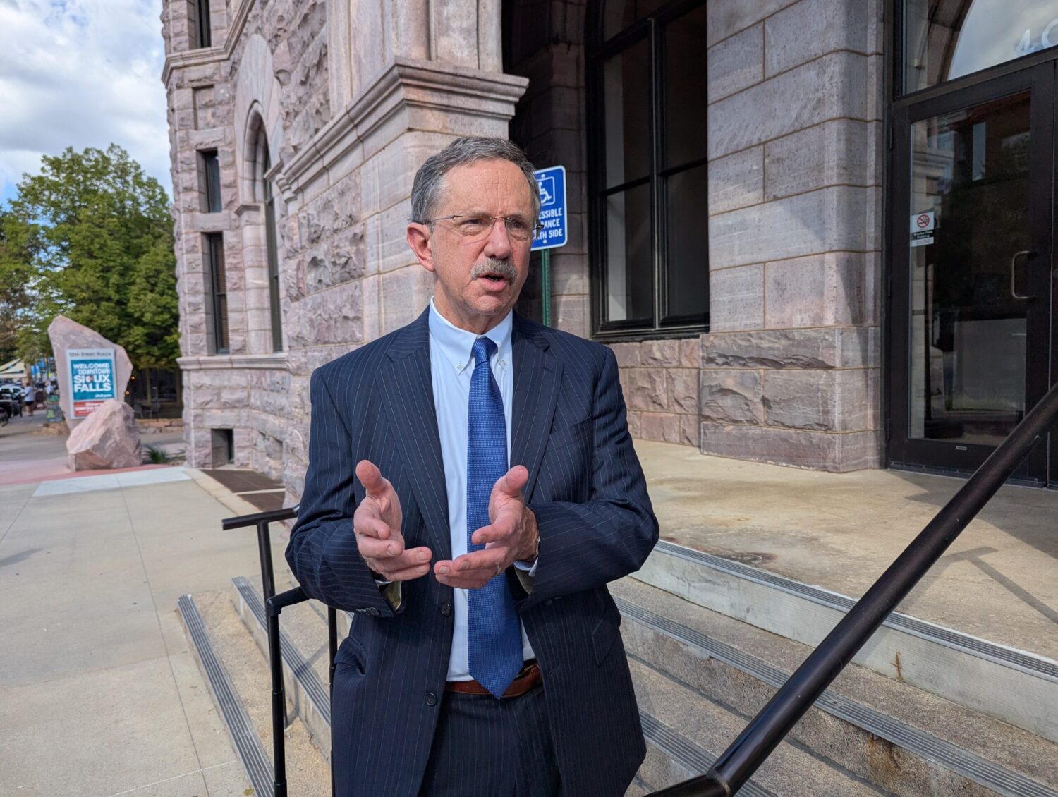 Judge temporarily restrains university from firing professor for post ...