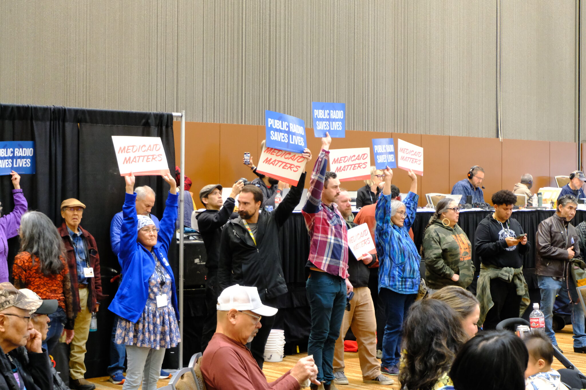 Dozens stand in silent protest of Sen. Sullivan during address to the ...
