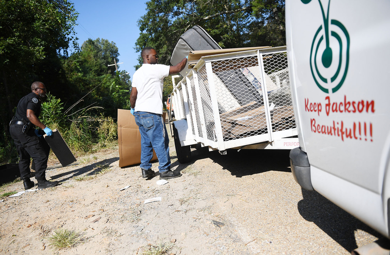 These JPD officers spend their days cleaning up illegal dump sites ...